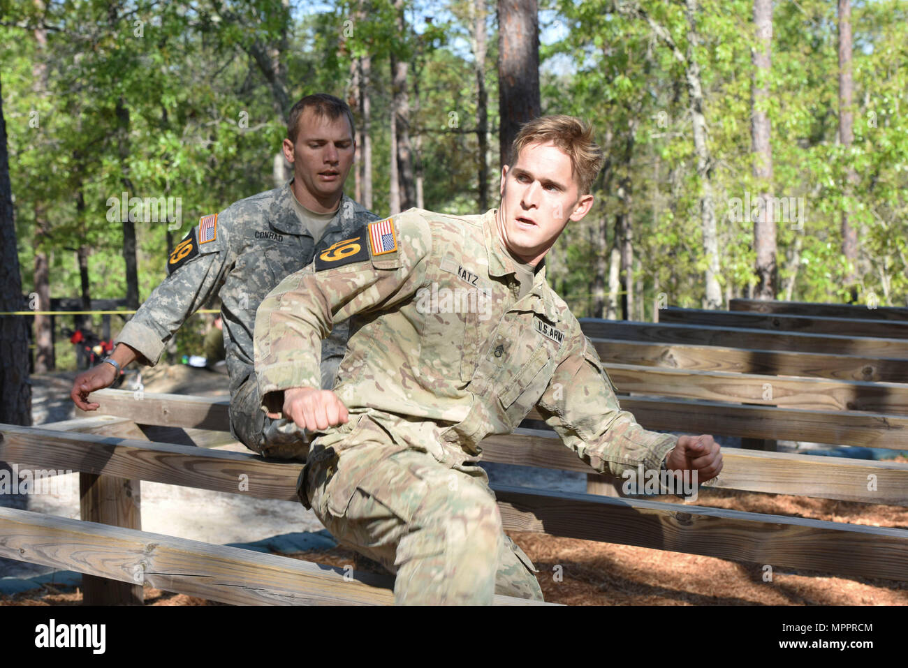 Army Staff Sgt. Luke Katz, right, with the Nebraska Army National Guard ...