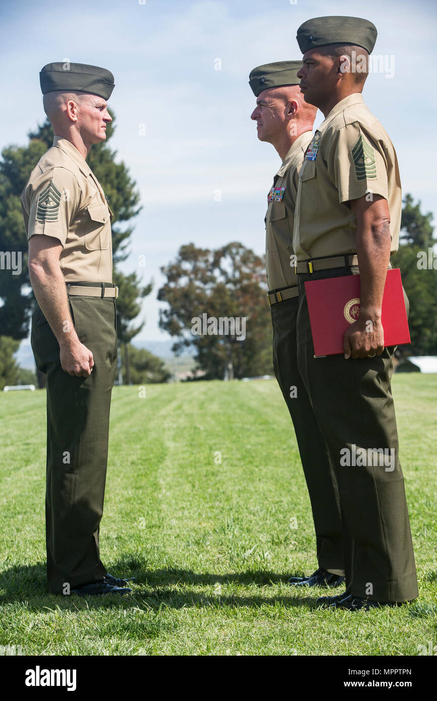 U.S. Marine Sgt. Maj. Troy E. Black receives an award from Brig. Gen ...