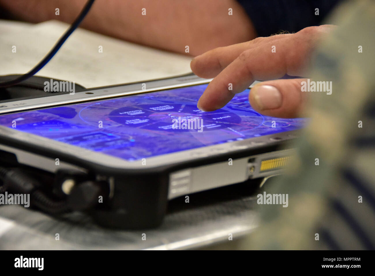 Senior Master Sgt. Justin of the 163d Attack Wing tries out a tablet ...