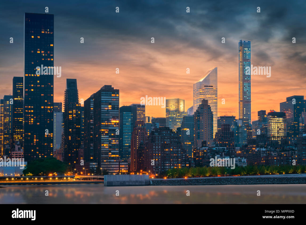 New York City skyline with urban skyscrapers at sunset, USA Stock Photo ...