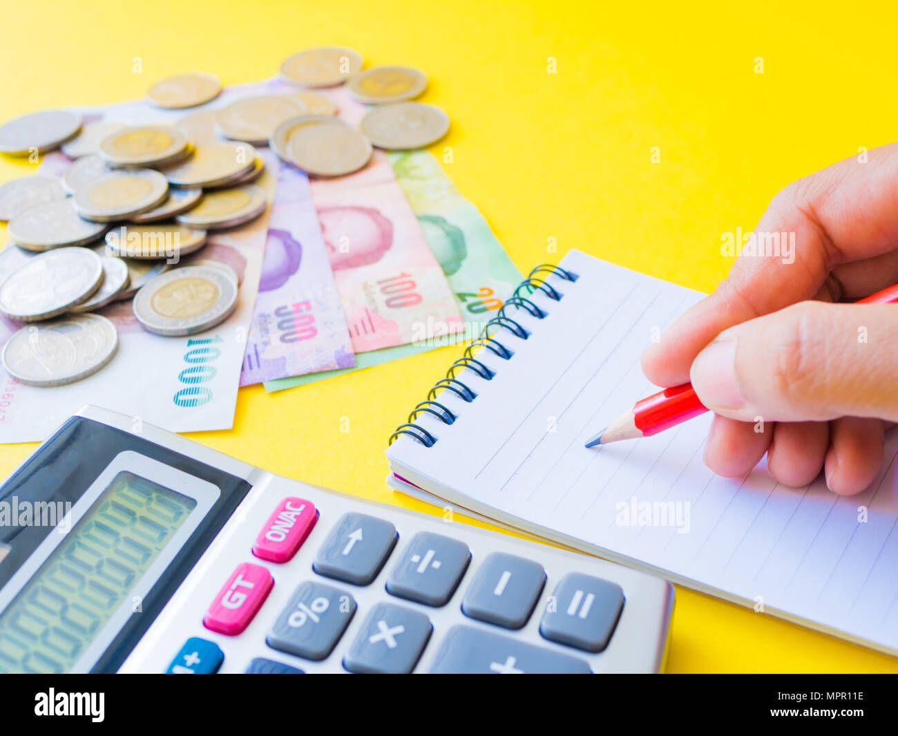 abstract money saving. Closed up woman hand using calculator with note ...