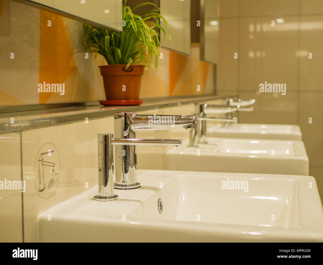 Interior of bathroom with sink basin faucet Stock Photo - Alamy