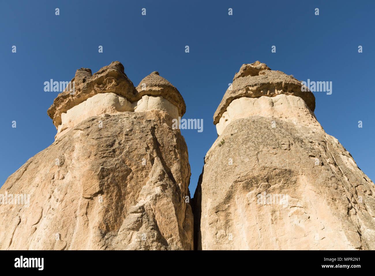 sculpted fairy chimneys in the volcanic tuff of Cappadocia Stock Photo ...