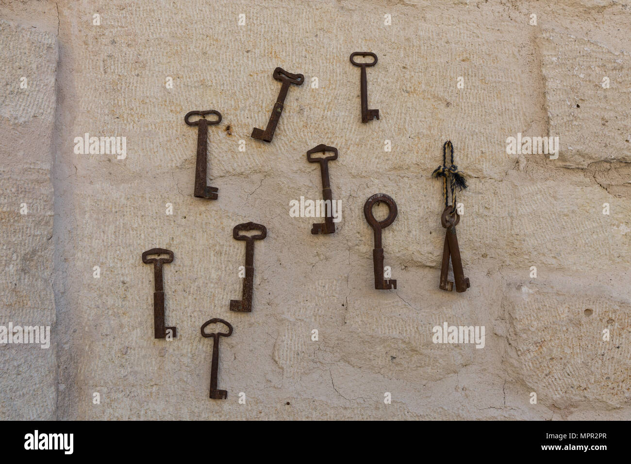 collection of keys hanging on a wall Stock Photo - Alamy