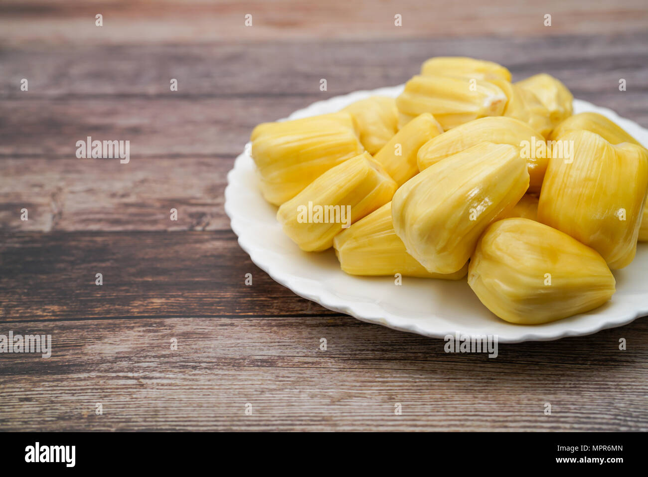 Fresh jackfruit slices on a white plate. sweet yellow jackfruit ripe ...