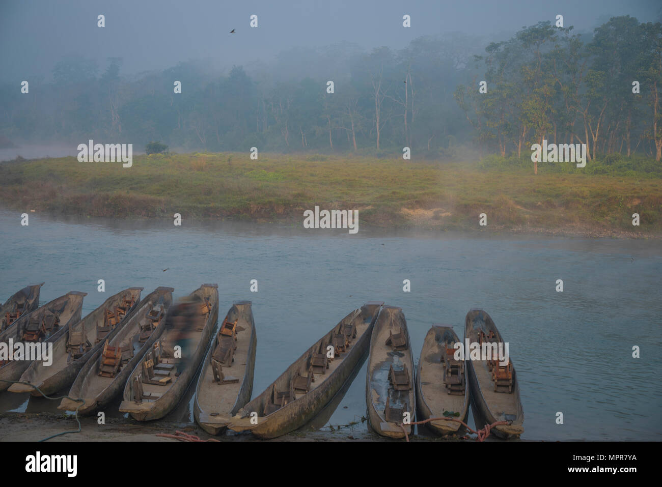 Chitwan Reserve in Nepal. Canoe for traveling through the river through ...