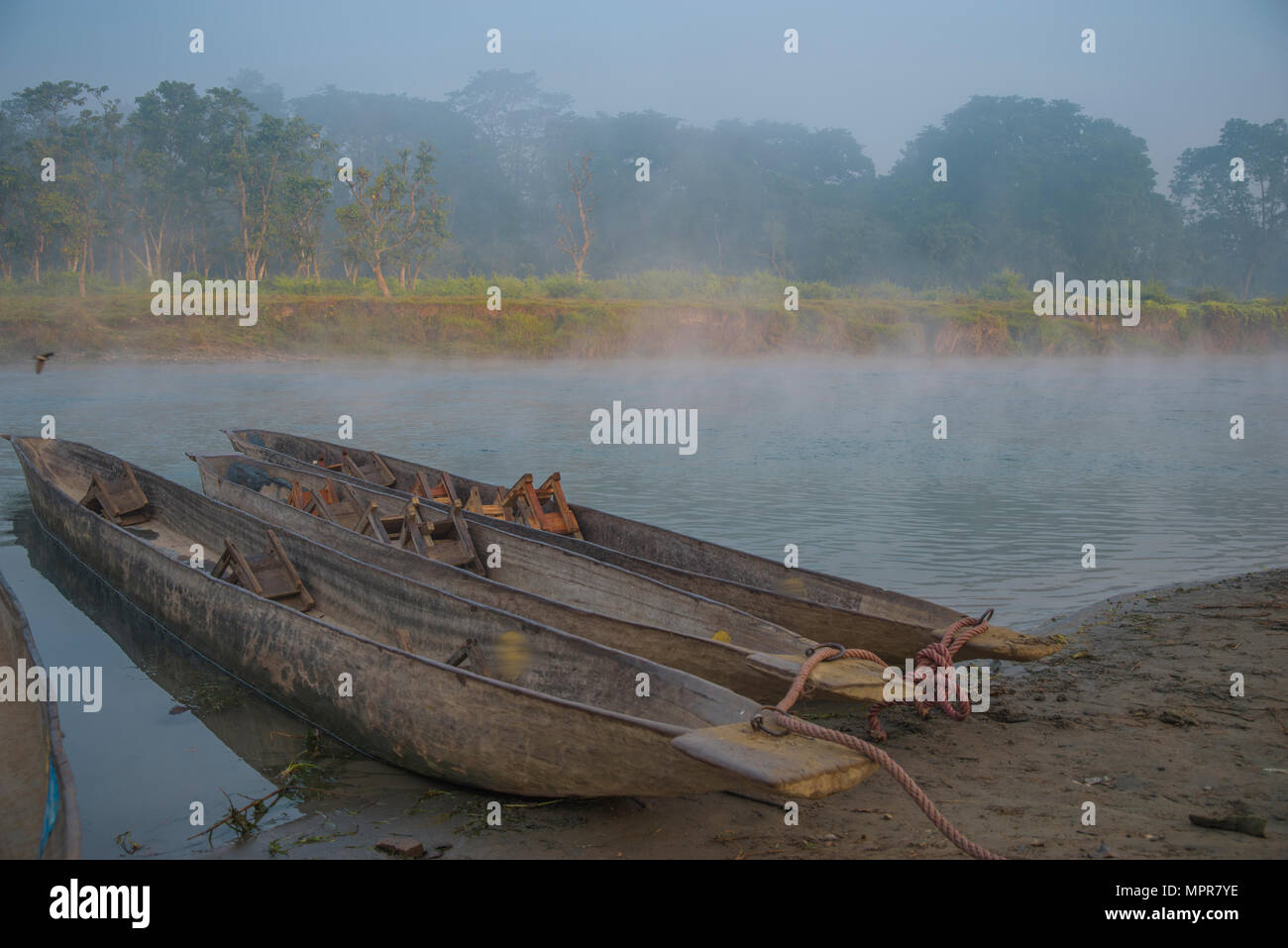 Chitwan Reserve in Nepal. Canoe for traveling through the river through ...