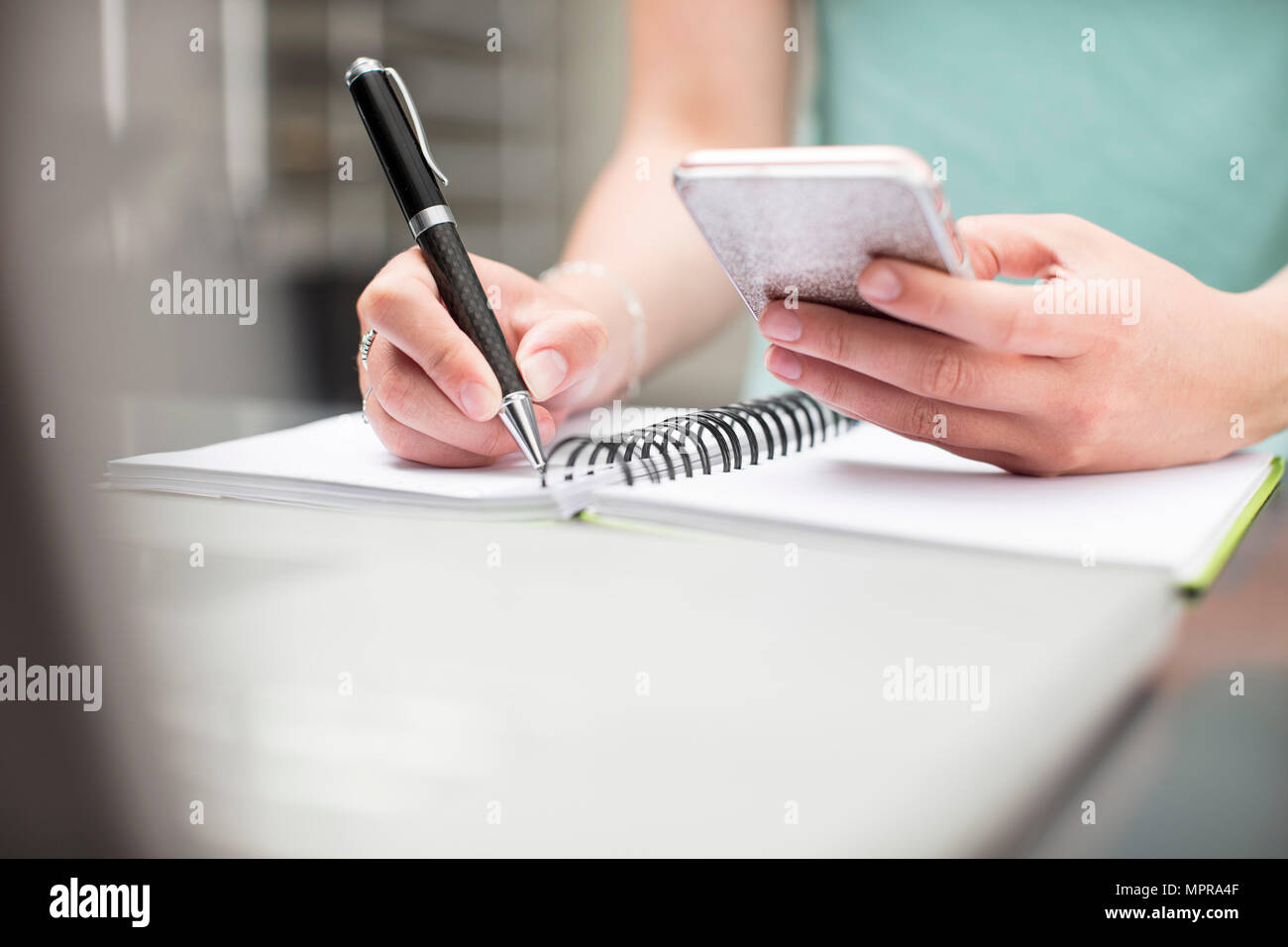 Woman writing a note hi-res stock photography and images - Alamy