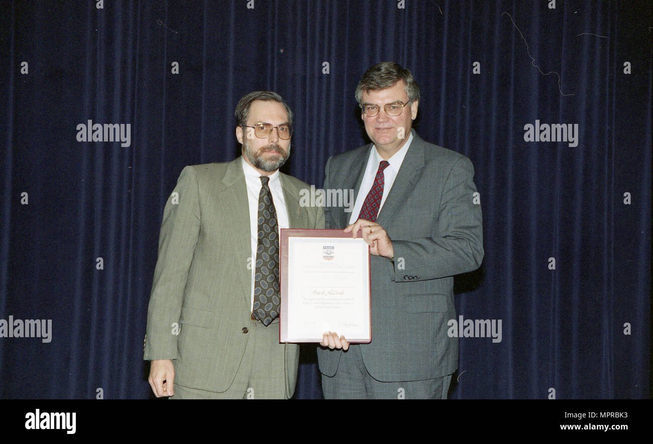 man accepting award taking a picture Stock Photo - Alamy