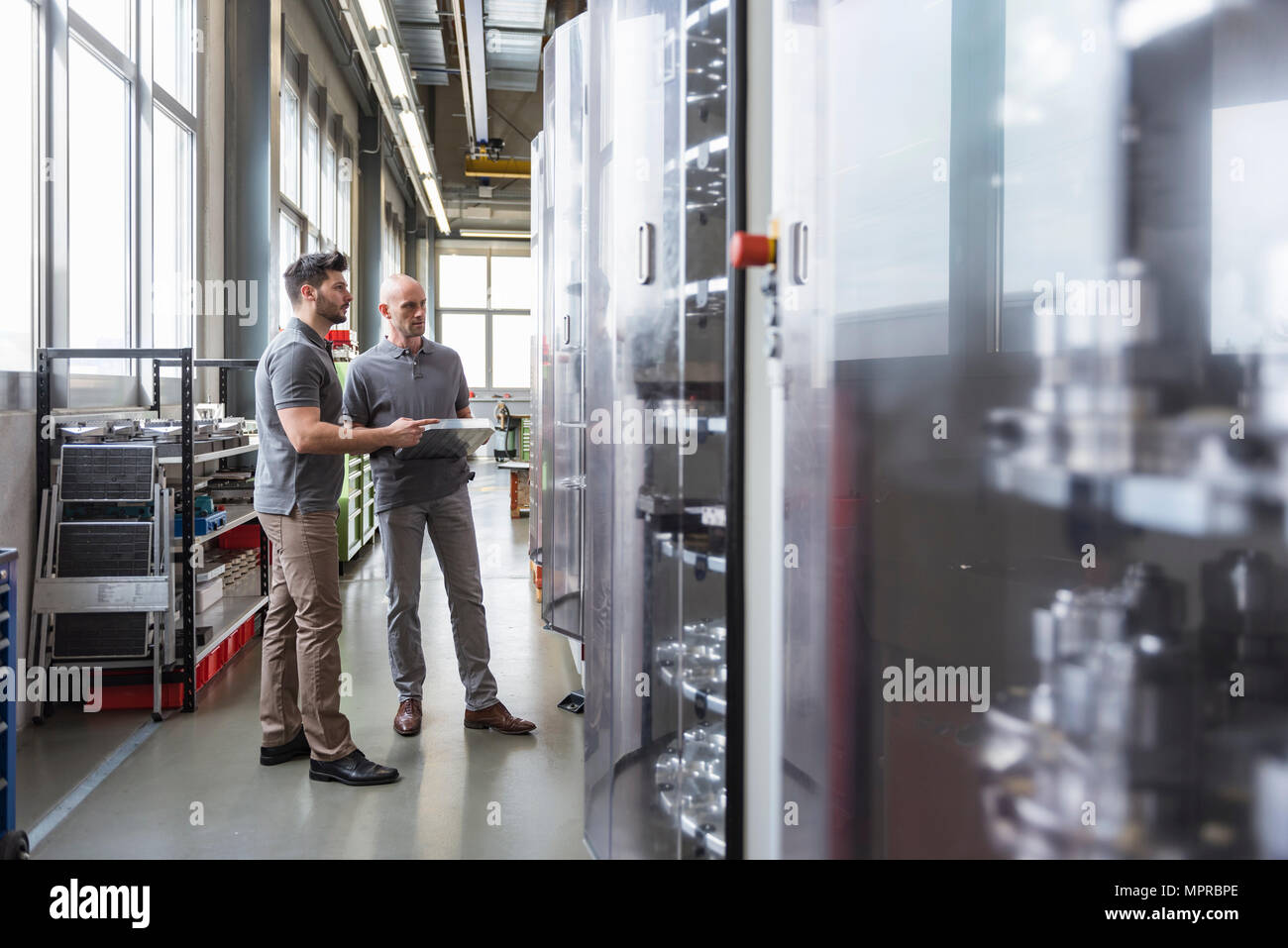 Two standing men hi-res stock photography and images - Alamy