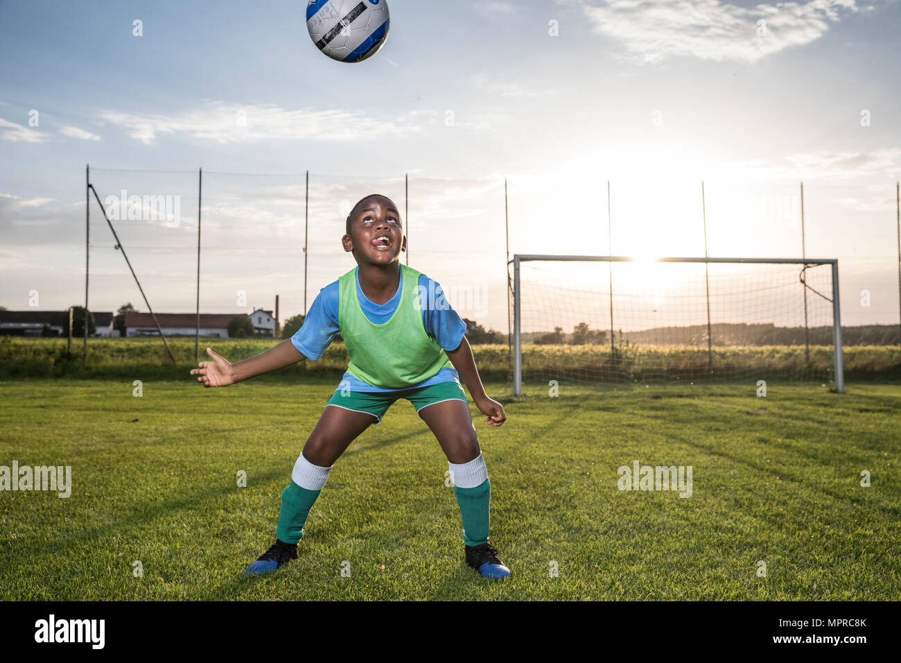 Kids soccer heading ball hi-res stock photography and images - Alamy