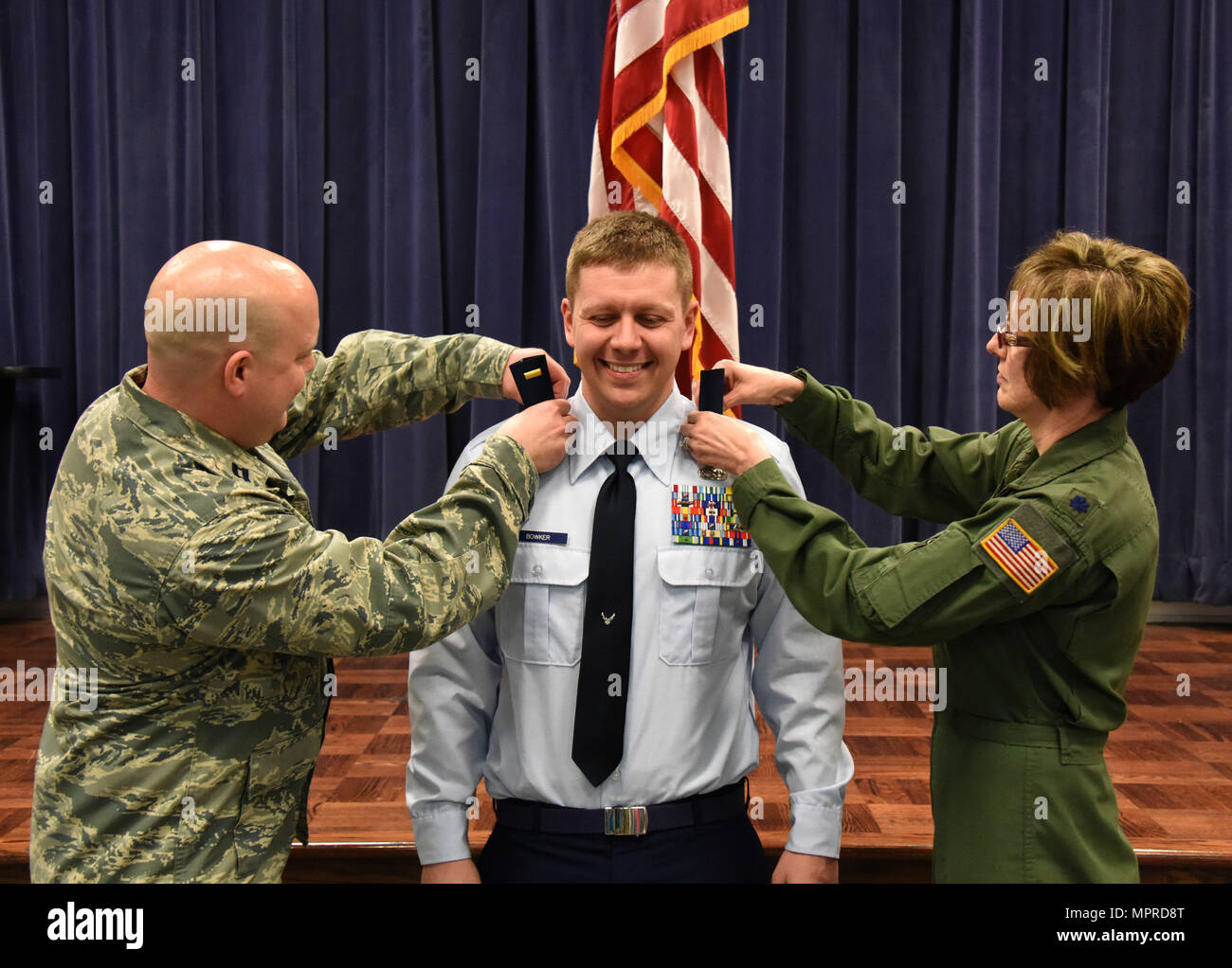 NEW CASTLE AIR NATIONAL GUARD BASE, Del. - Gold bars are pinned onto ...