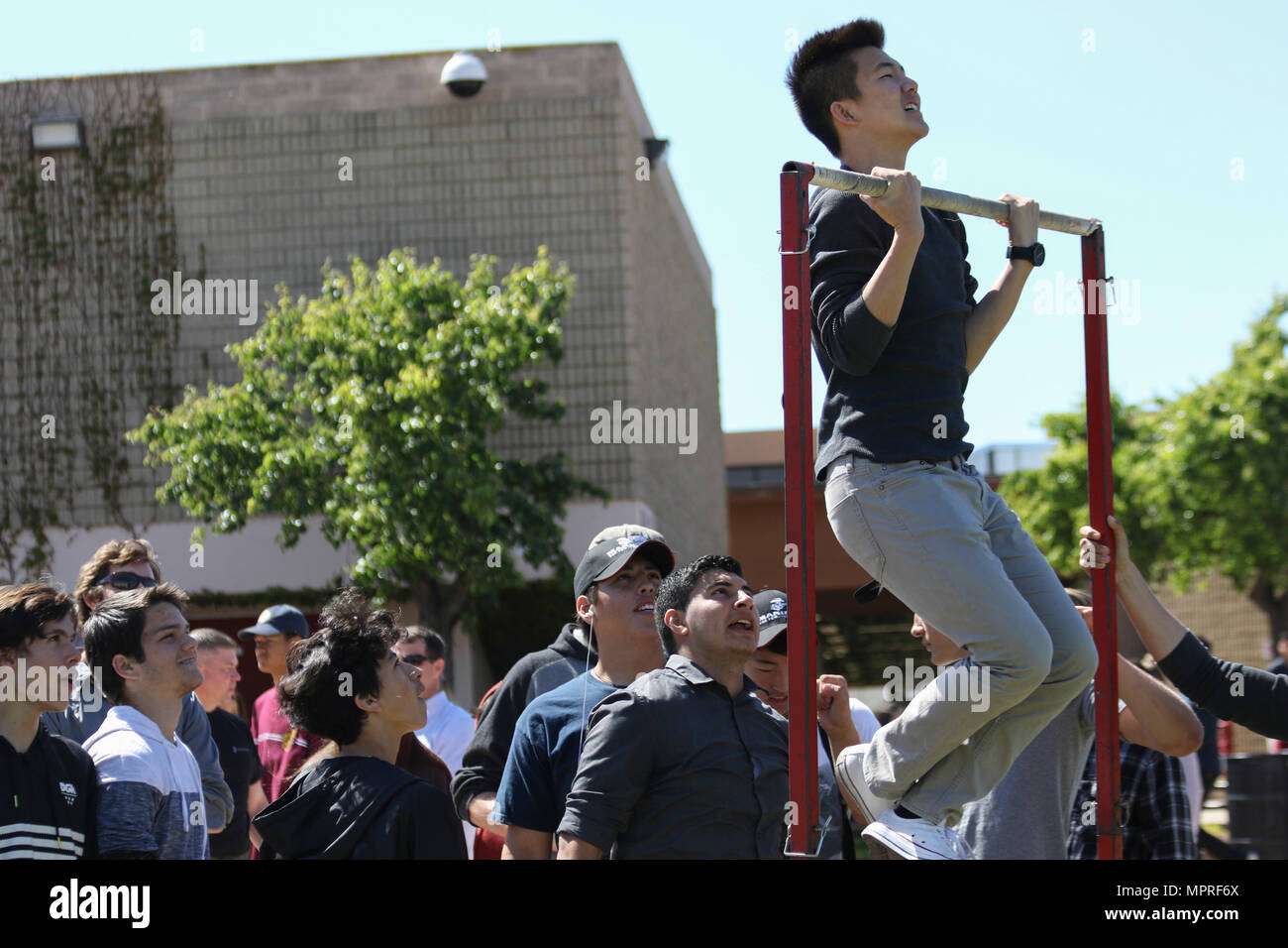 Future Marines cheer on fellow students during a pull-up challenge at ...