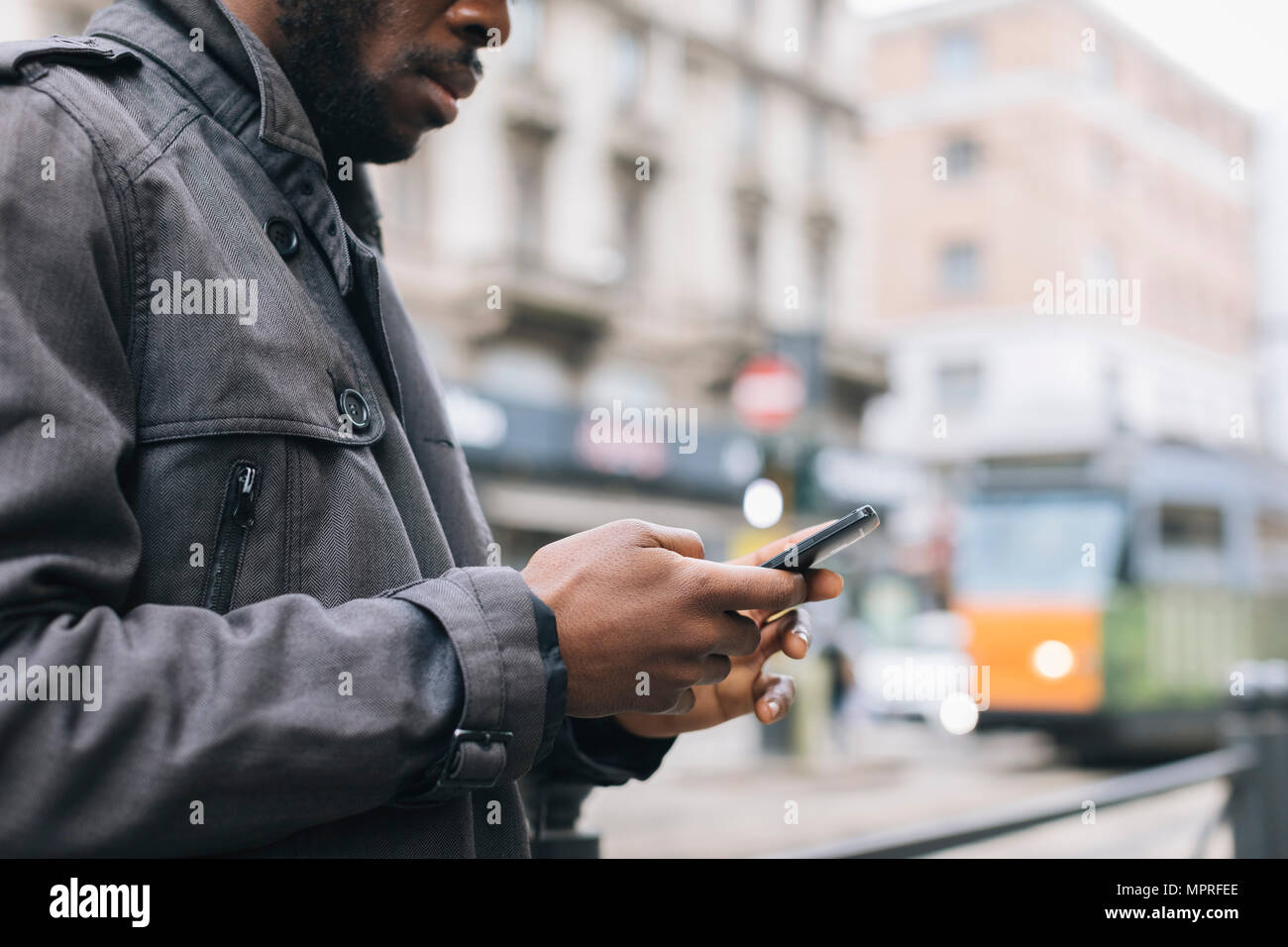 Commuters checking cell phones hi-res stock photography and images - Alamy