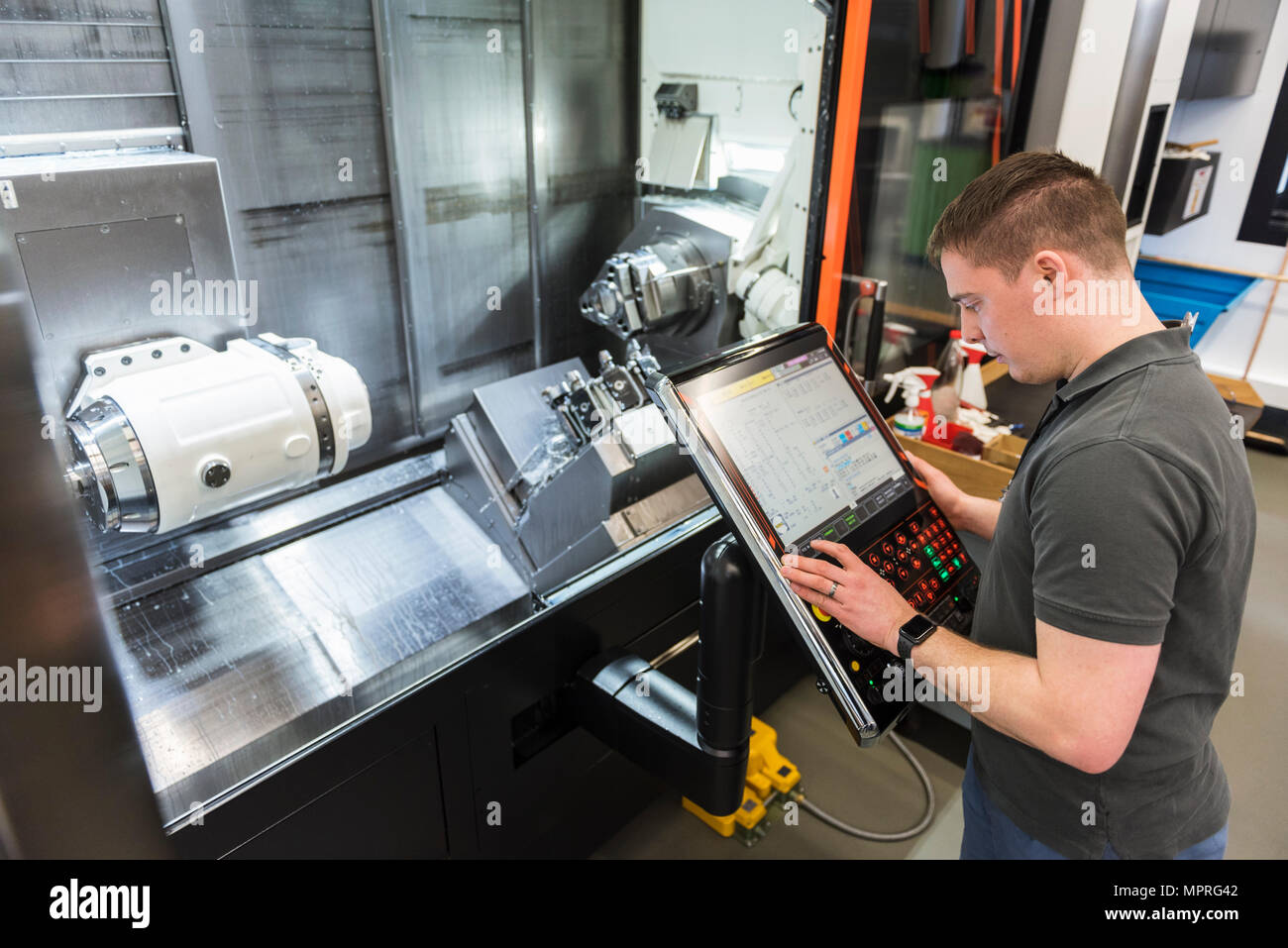 Machine operating man hi-res stock photography and images - Alamy