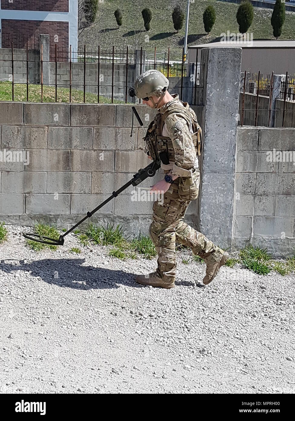 Tech. Sgt. Adam Wickizer searches for simulated improvised explosive ...