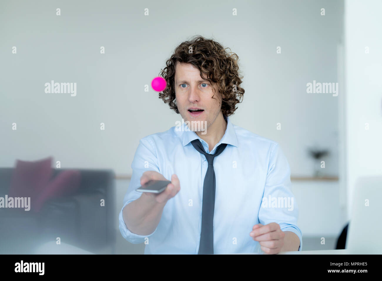 Playing with a mobile phone hi-res stock photography and images - Alamy