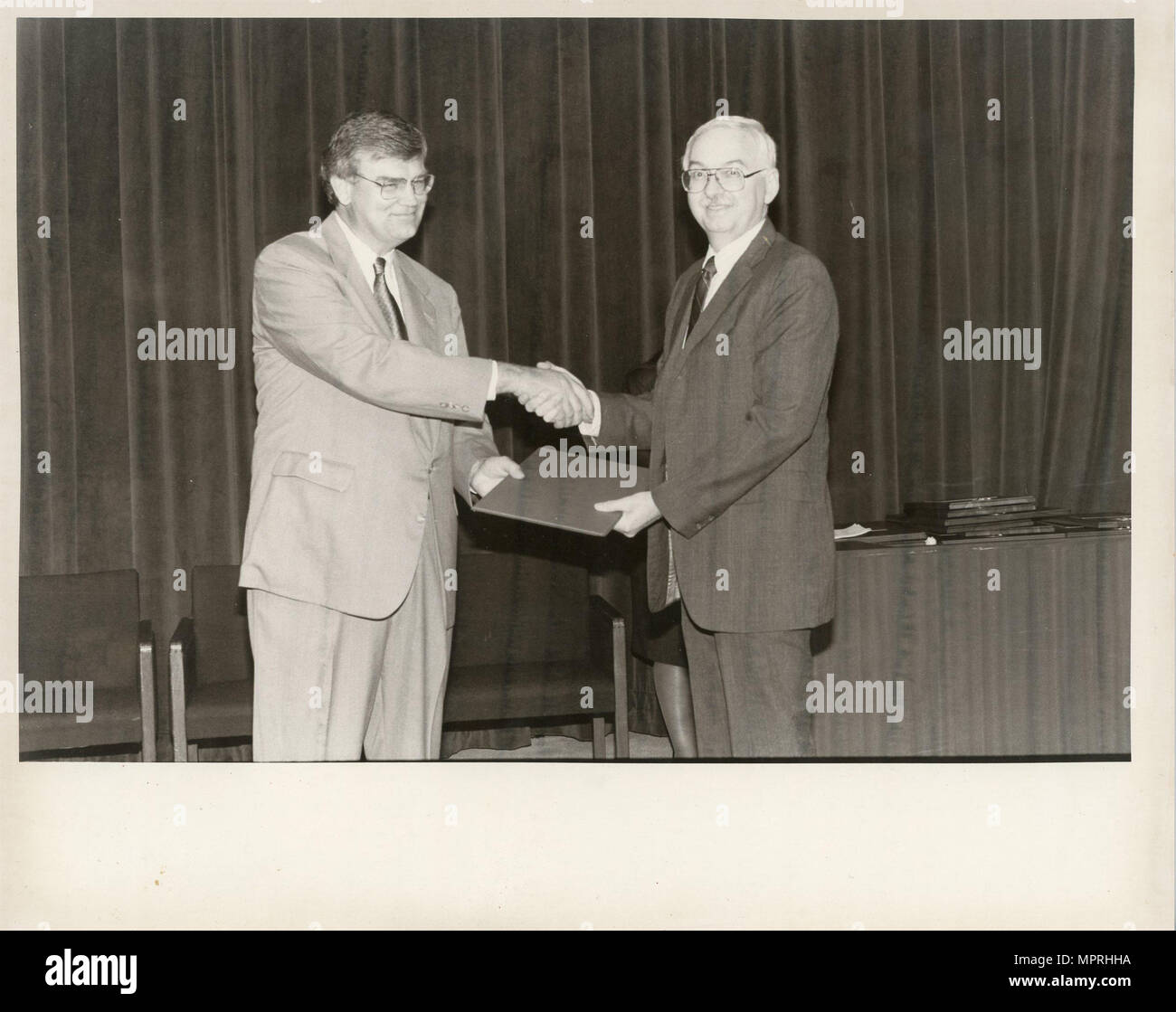 Admin. Atwood presenting general awards - Man receiving award on stage ...