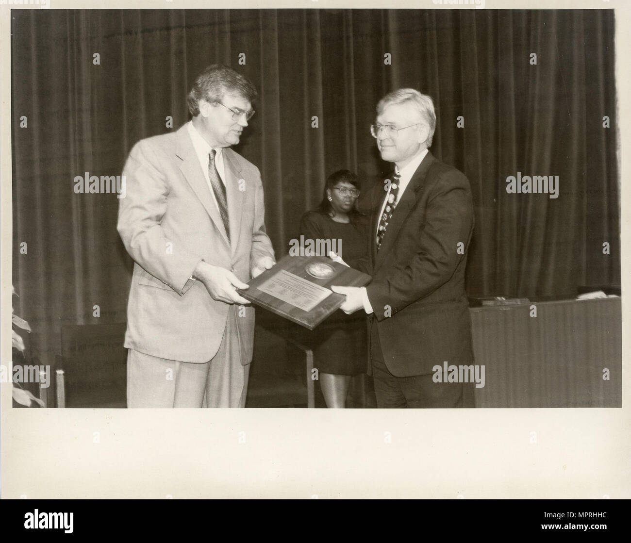 Admin. Atwood presenting general awards - Man receiving award on stage ...