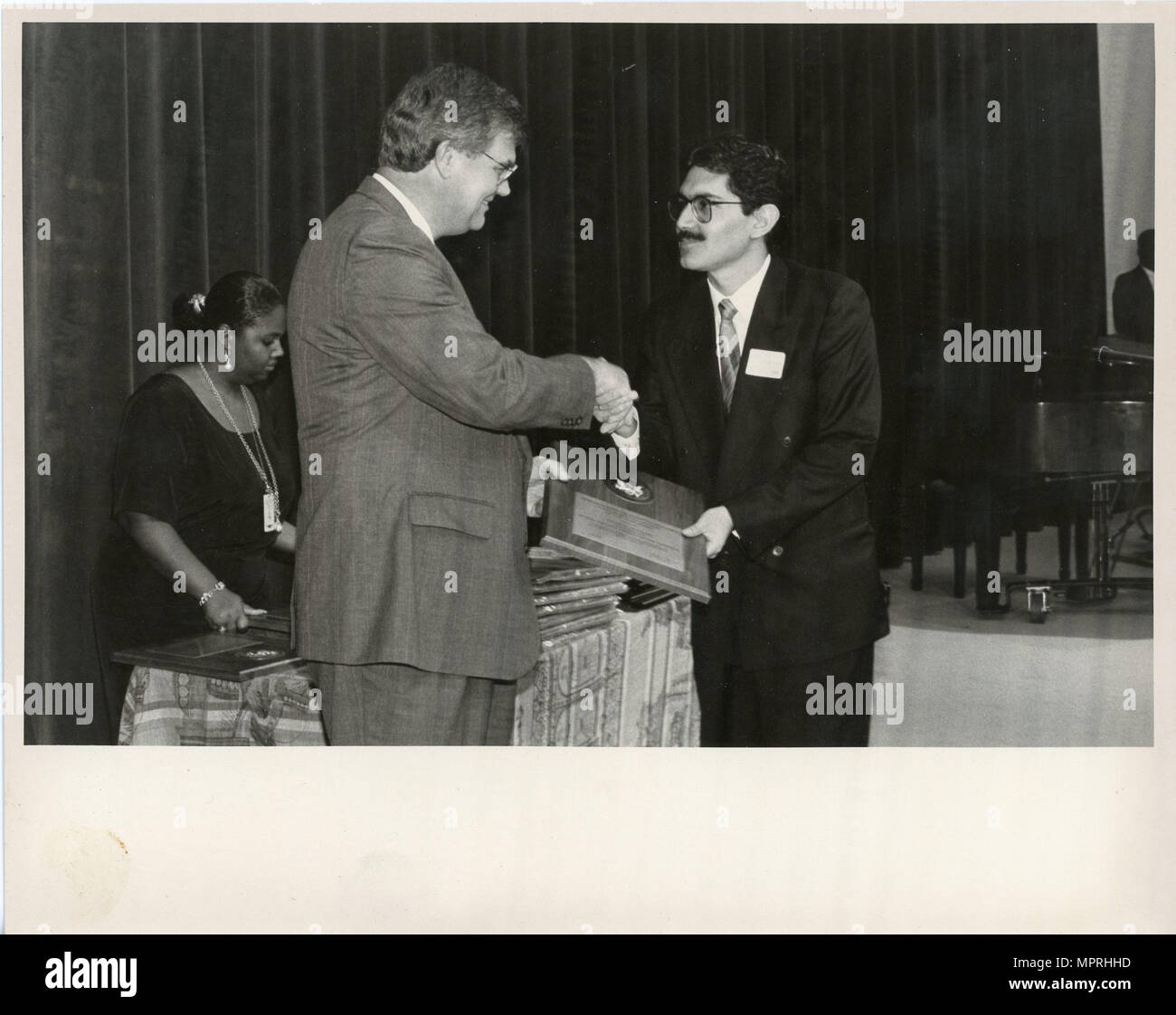 Admin. Atwood presenting general awards - Man receiving award on stage ...