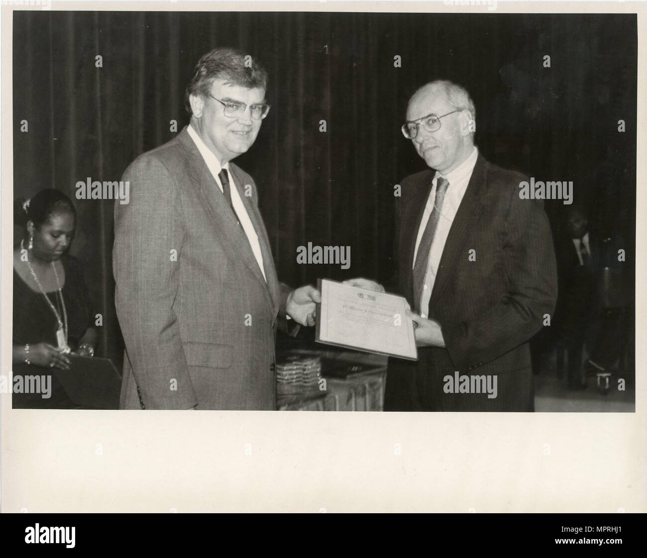 Admin. Atwood presenting general awards - Man receiving award on stage ...