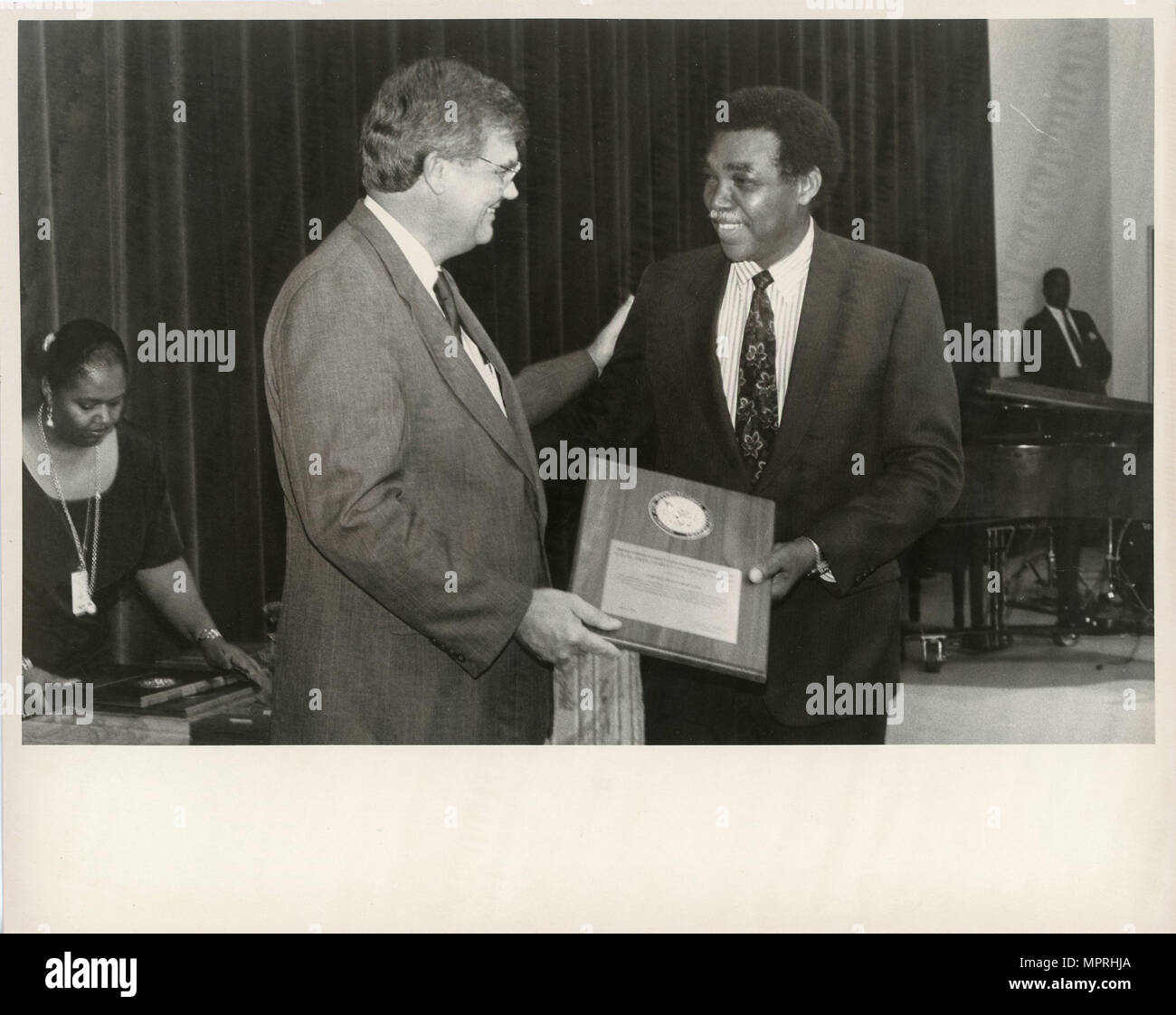 Admin. Atwood presenting general awards - Man receiving award on stage ...