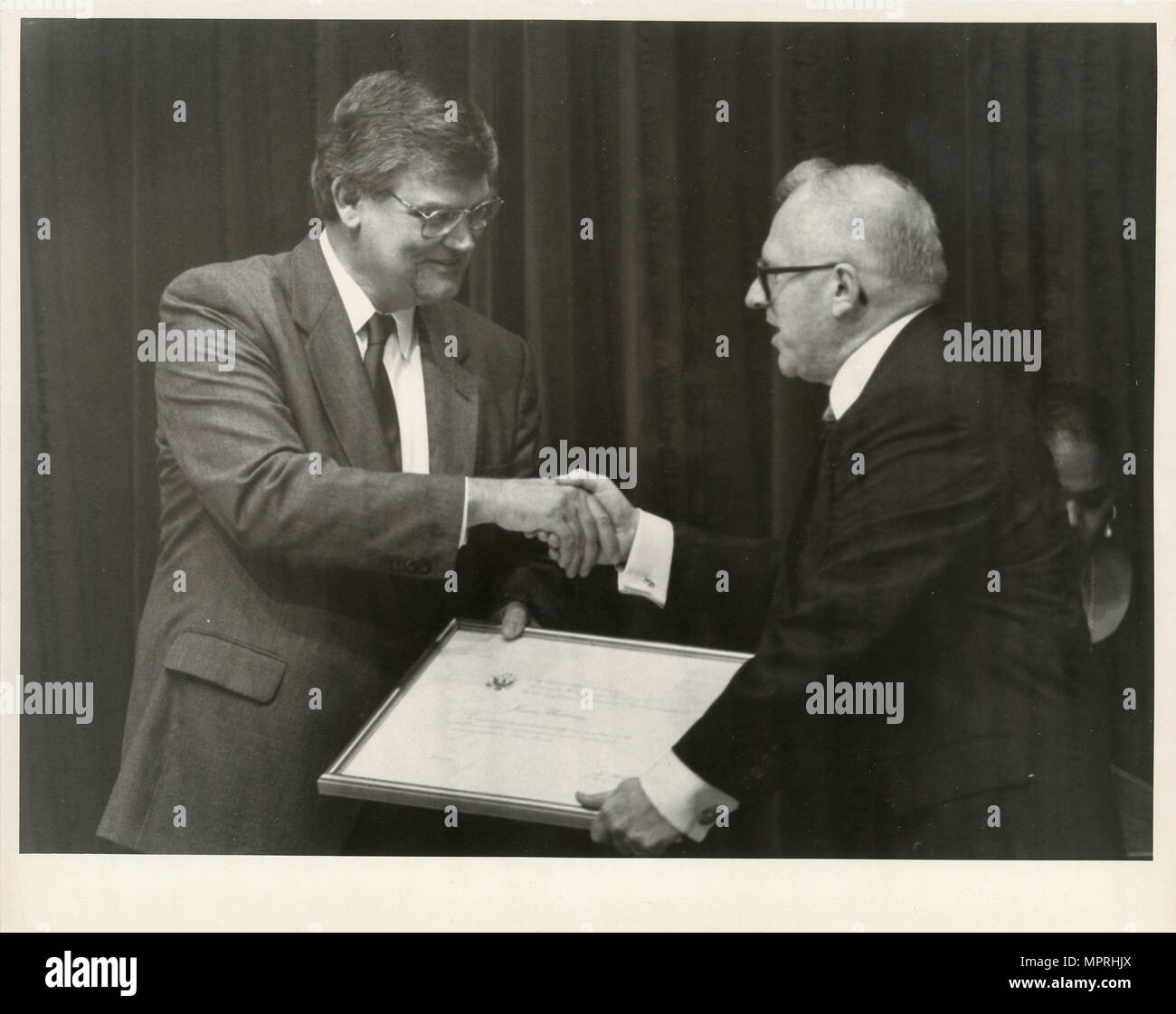 Admin. Atwood presenting general awards - Man receiving award on stage ...