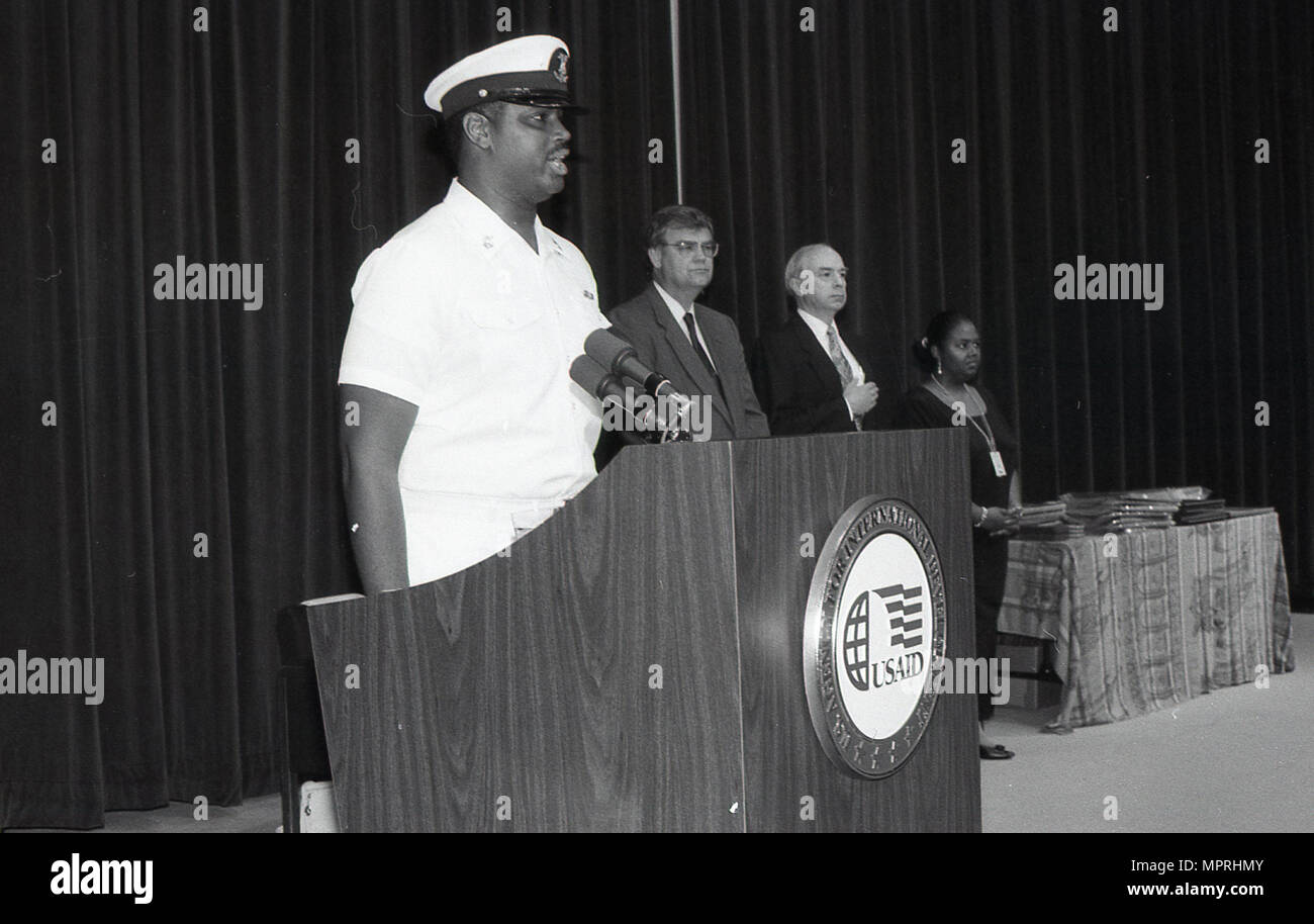 Admin. Atwood presenting general awards - Official speaking at podium ...