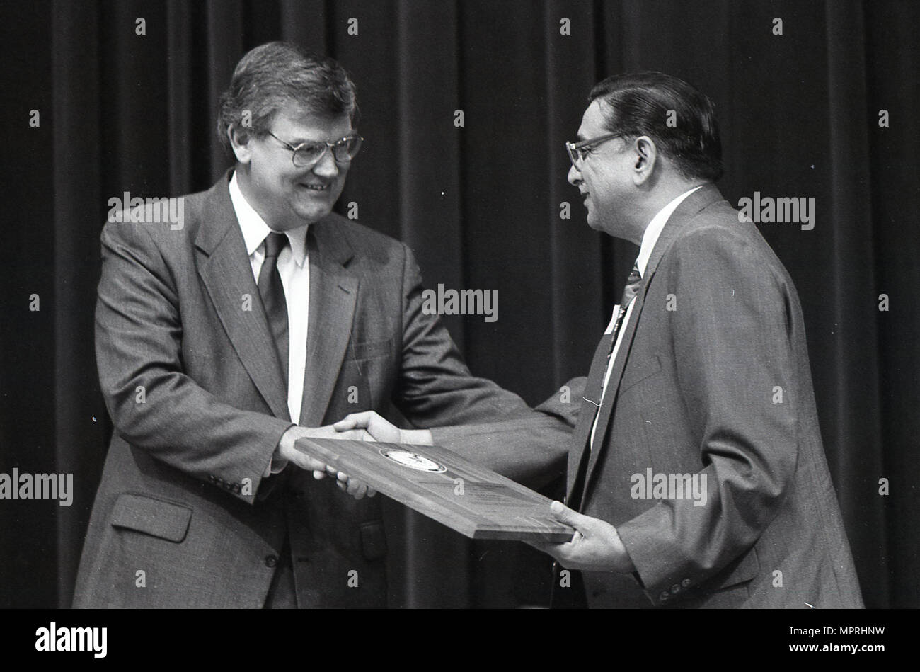 Admin. Atwood presenting general awards - Man receiving award on stage ...