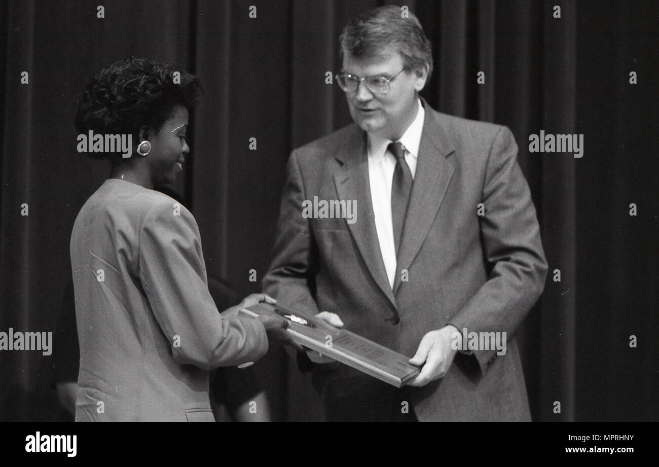 Admin. Atwood presenting general awards - Woman receiving award Stock ...