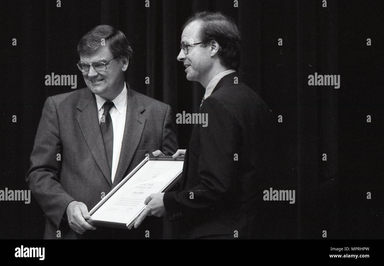 Admin. Atwood presenting general awards - Man receiving award on stage ...