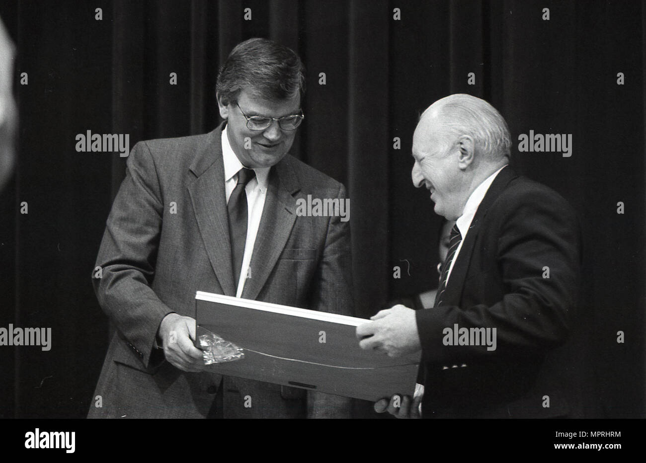 Admin. Atwood presenting general awards - Man receiving award on stage ...