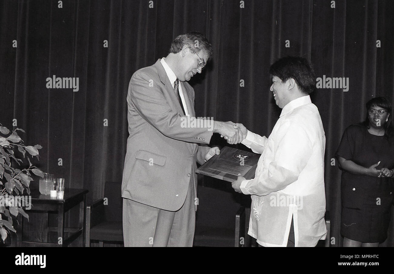 Admin. Atwood presenting general awards - Man receiving award on stage ...