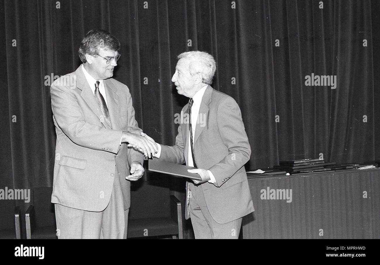 Admin. Atwood presenting general awards - Man receiving award on stage ...