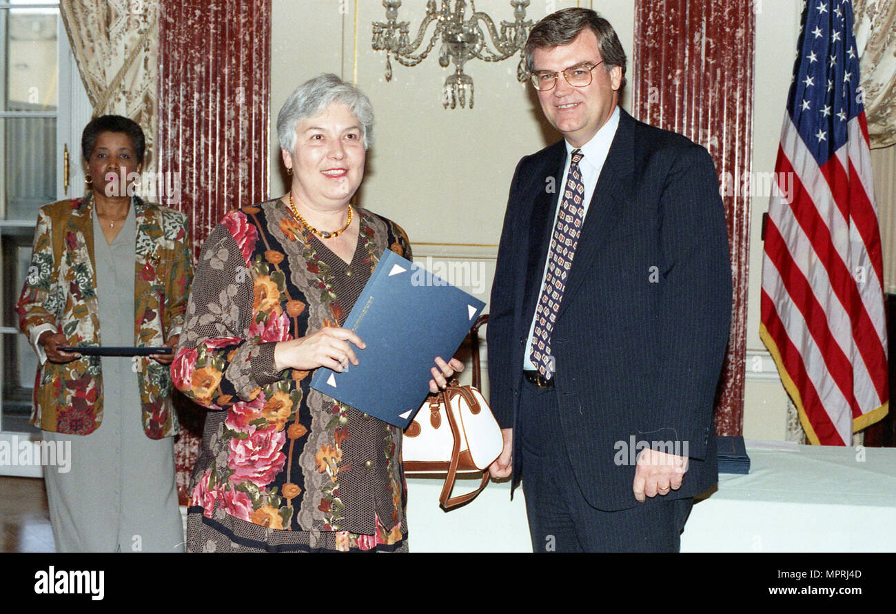 woman accepting award taking a picture Stock Photo - Alamy