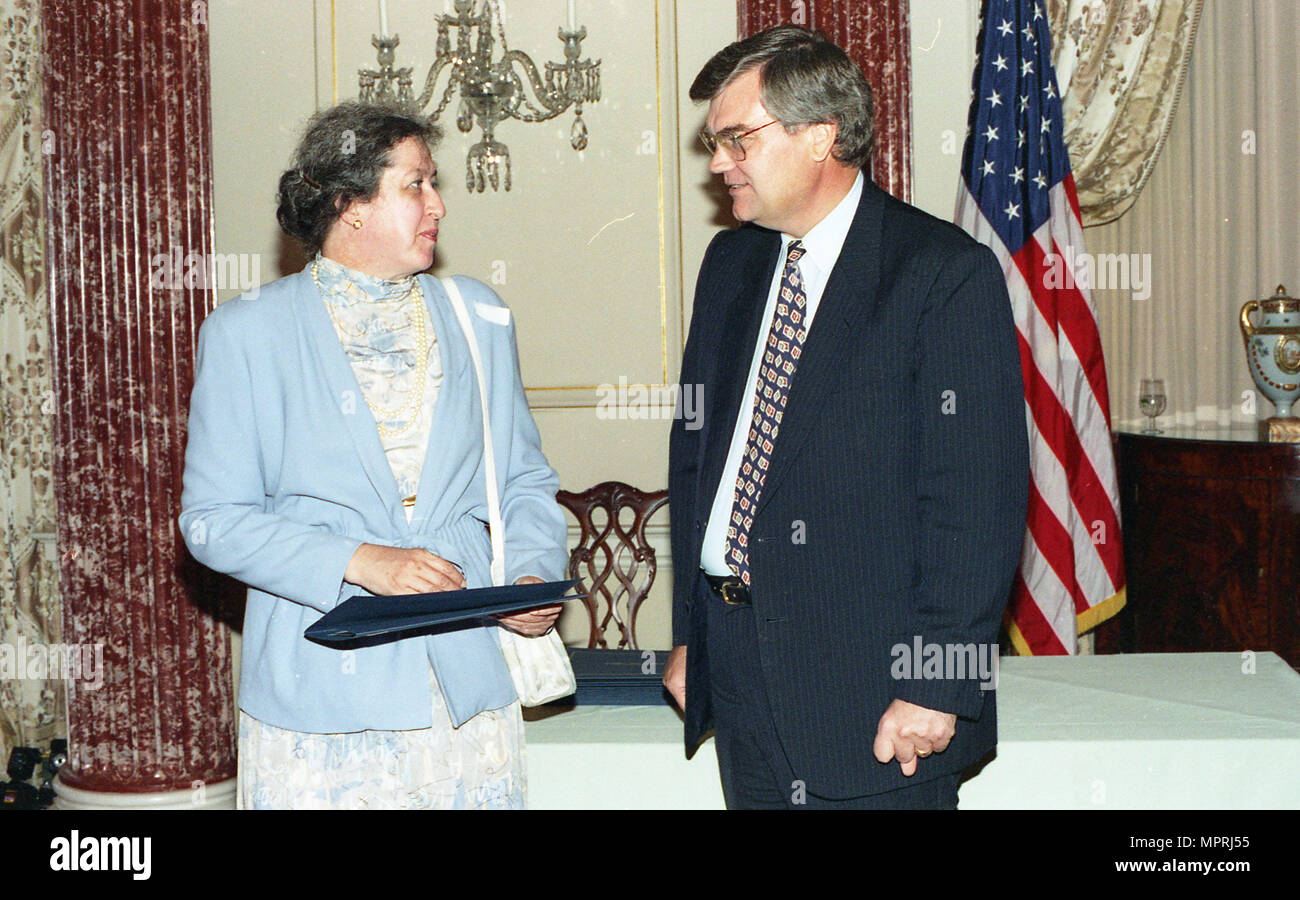 woman accepting award taking a picture Stock Photo - Alamy