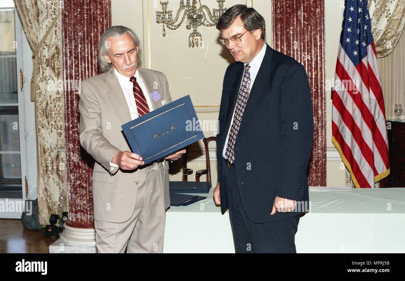 man accepting award taking a picture Stock Photo - Alamy