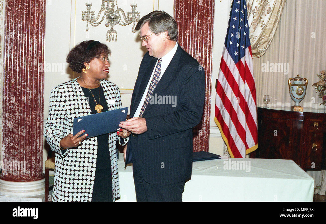 woman accepting award taking a picture Stock Photo - Alamy