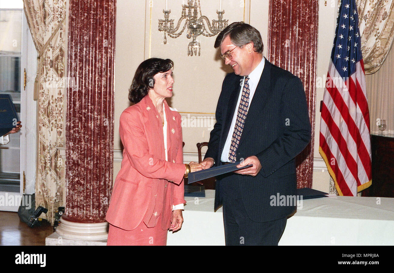 woman accepting award taking a picture Stock Photo - Alamy