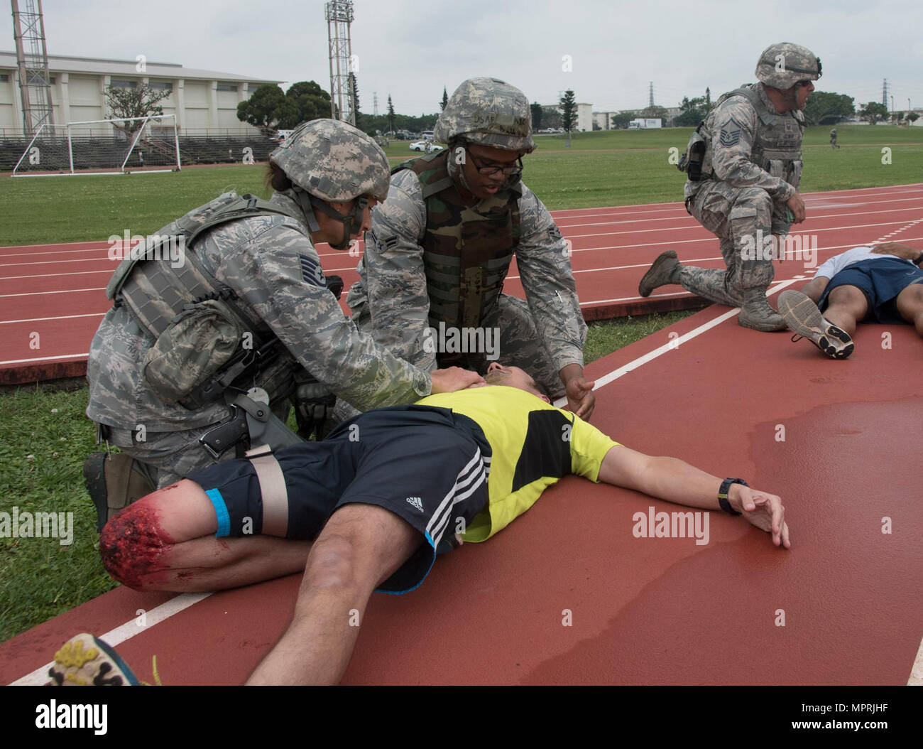 U.S. Air Force Airmen provide aid to simulated victims of an attack ...