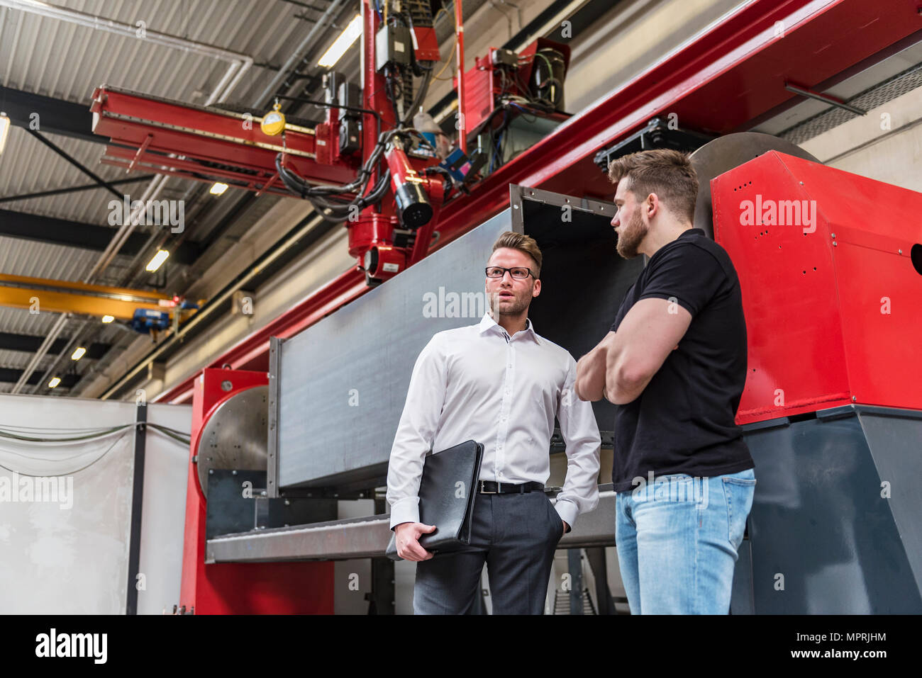 Two men standing together hi-res stock photography and images - Alamy