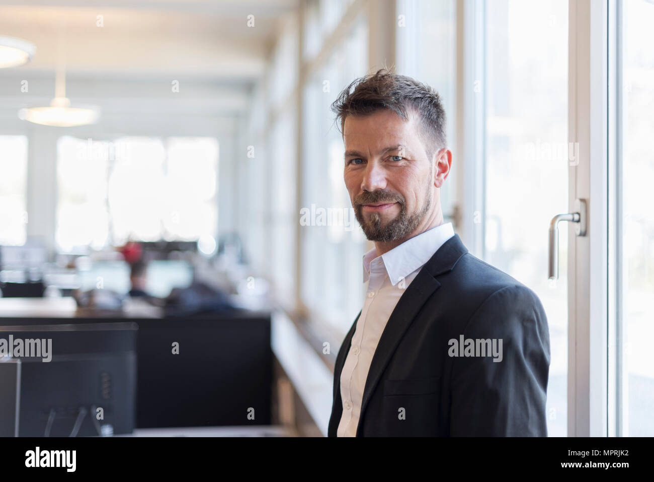 Standing portrait serious. hi-res stock photography and images - Alamy
