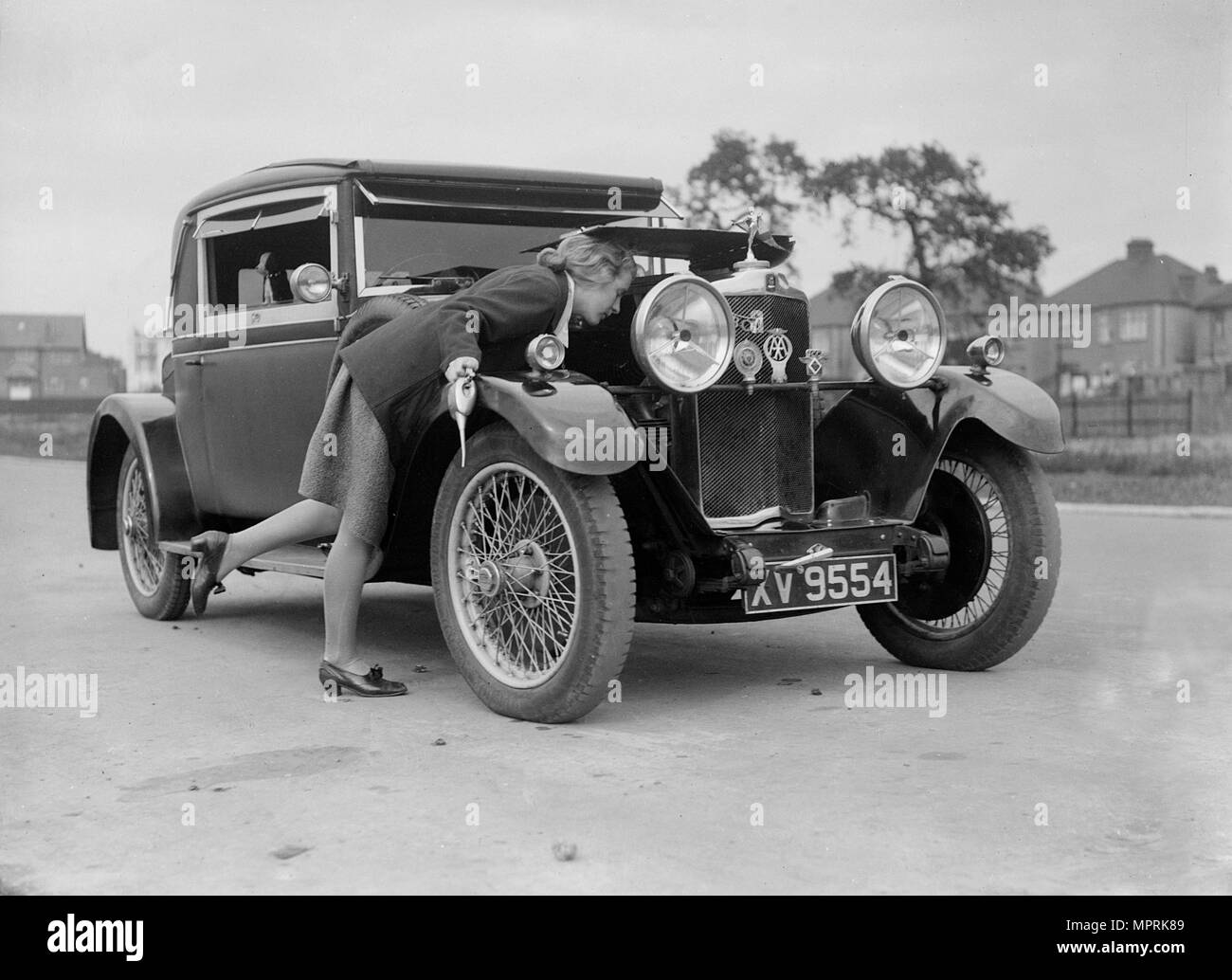 Kitty Brunell looking under the bonnet of a Talbot 14/45 sportsman's ...
