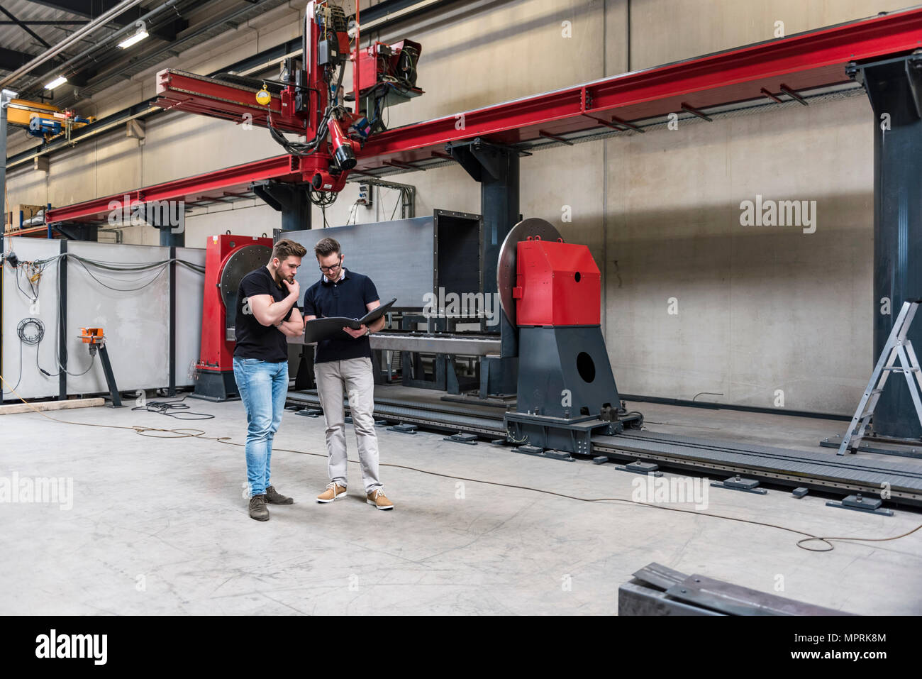 Two men standing together hi-res stock photography and images - Alamy