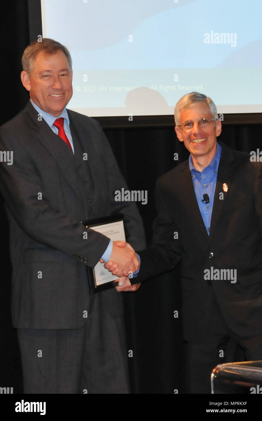 (left to right) Jonathan B. Cory is congratulated by William Jeffrey ...