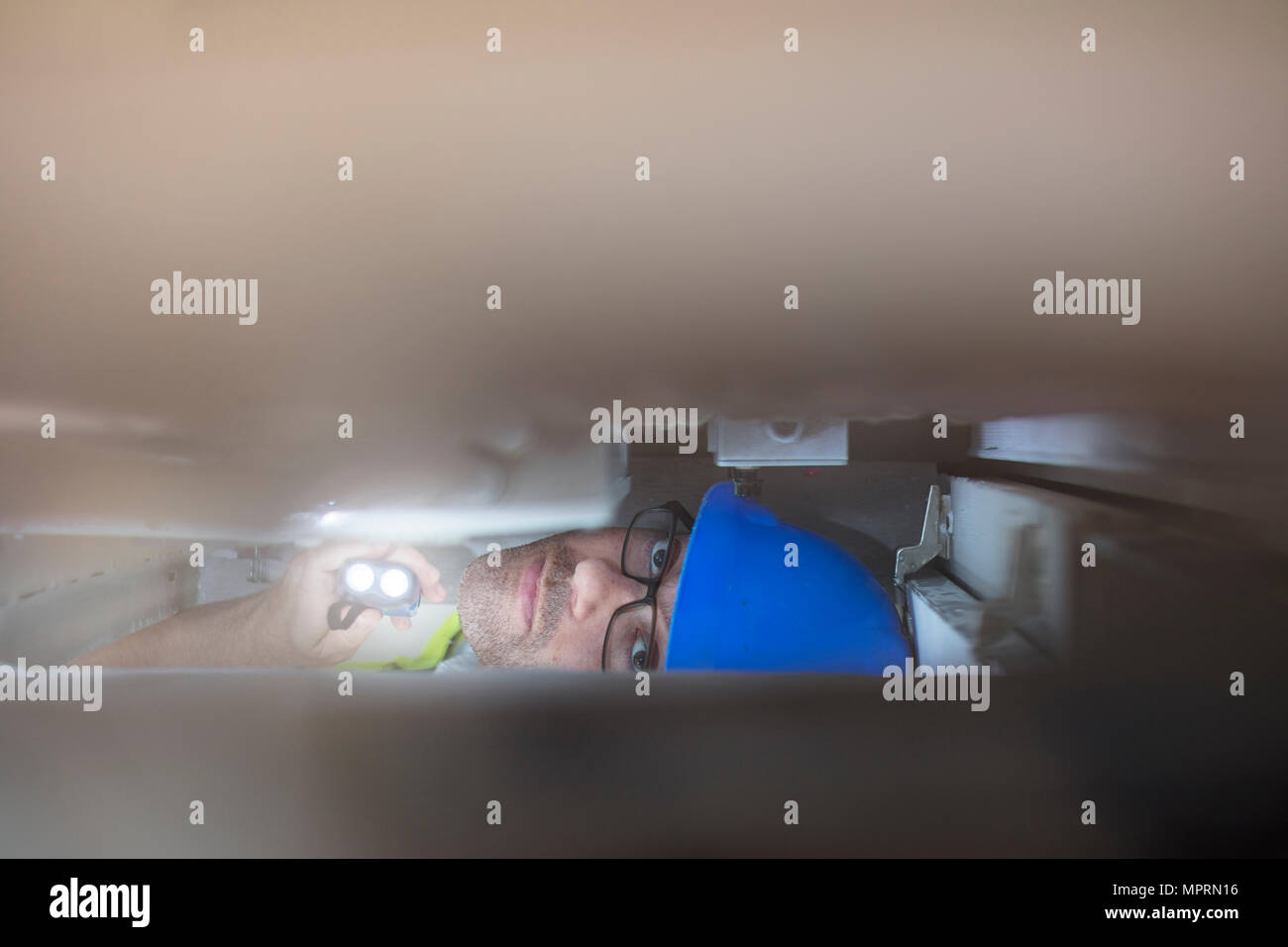 Electrician giving light with flashlight Stock Photo - Alamy