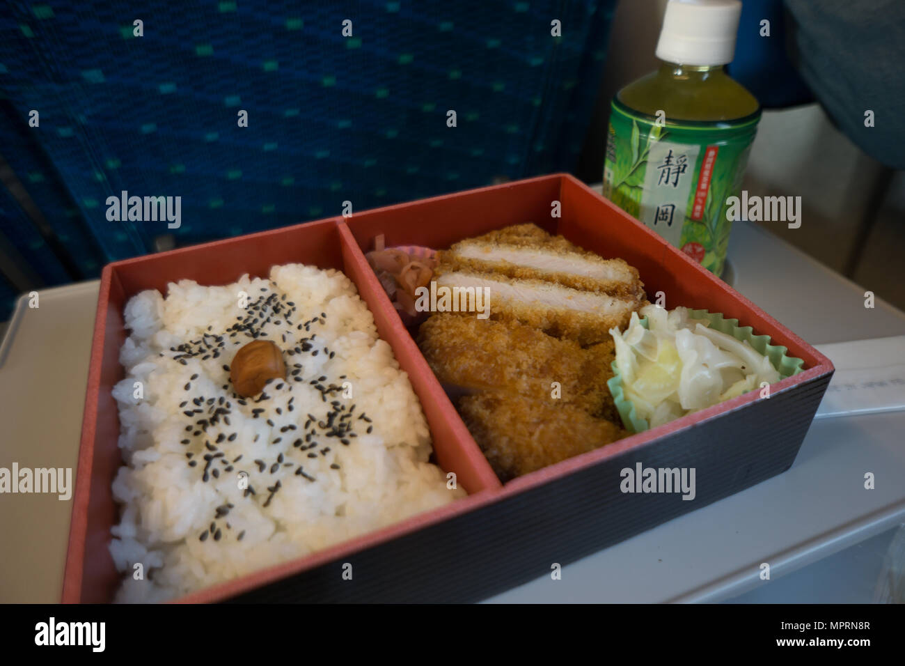Tonkatsu bento in japanese shinkansen Stock Photo - Alamy