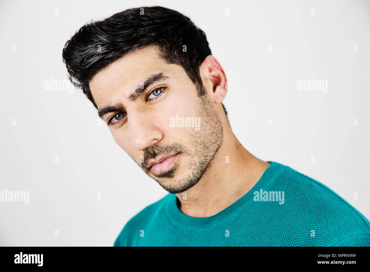 Portrait of serious young man with stubble Stock Photo - Alamy