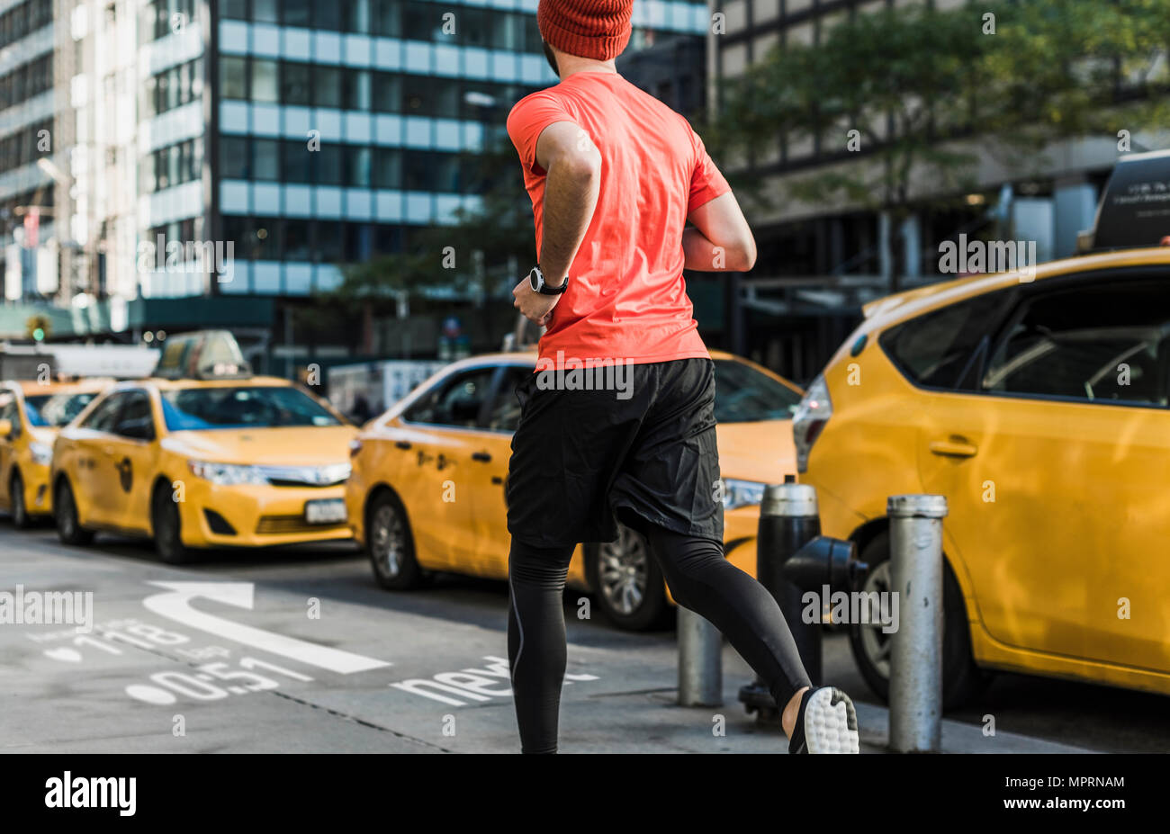 USA, New York City, man running in the city with data on pavement Stock ...