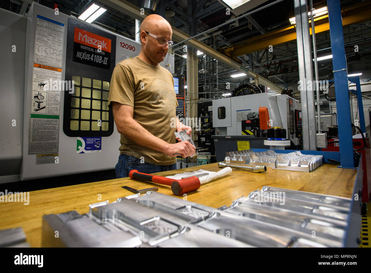 Machinist Tom Henrie, 532nd Commodities Maintenance Squadron, checks ...